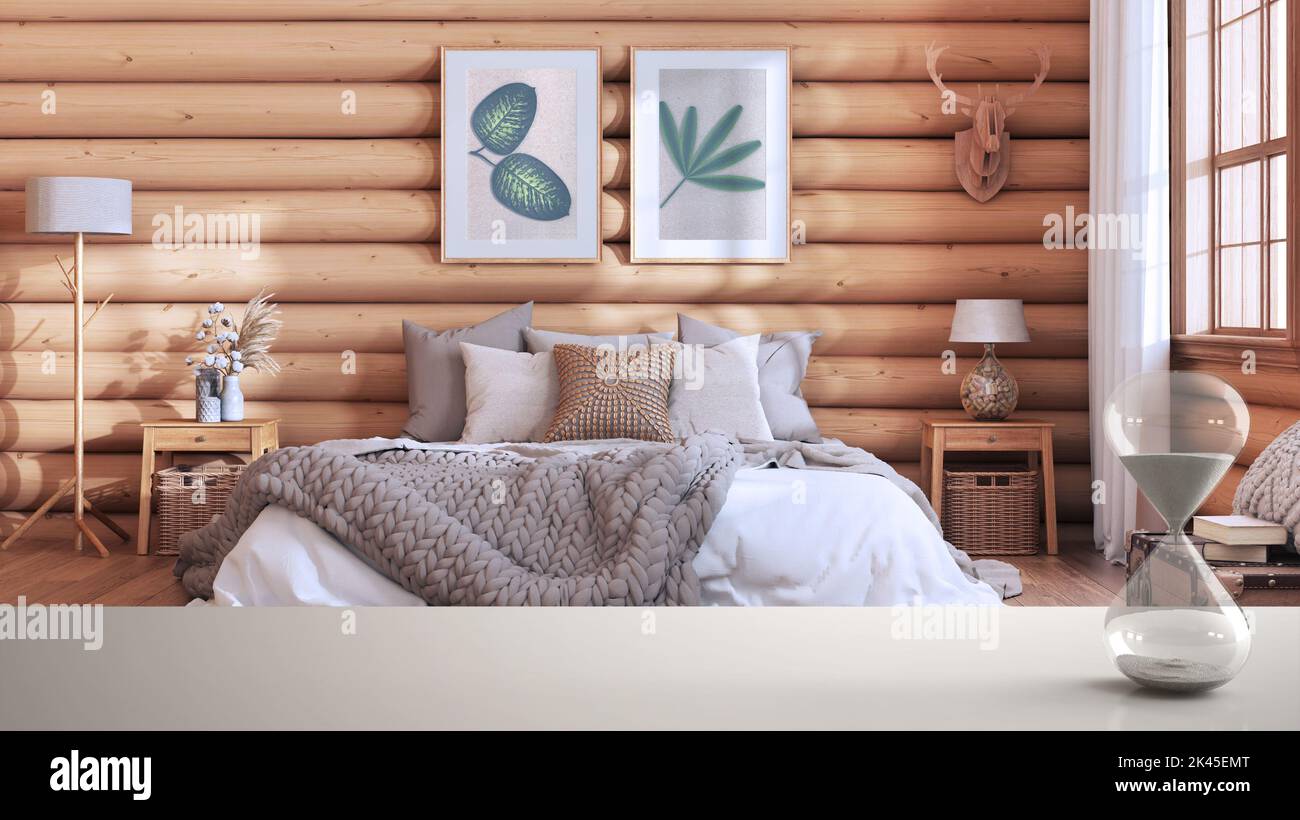 White table or shelf with crystal hourglass measuring the passing time ...