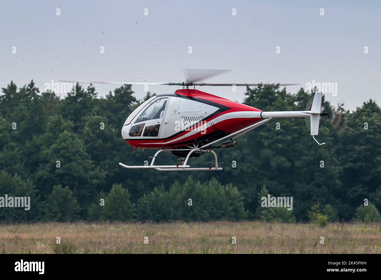 Takeoff of a small helicopter in the airfield Stock Photo - Alamy