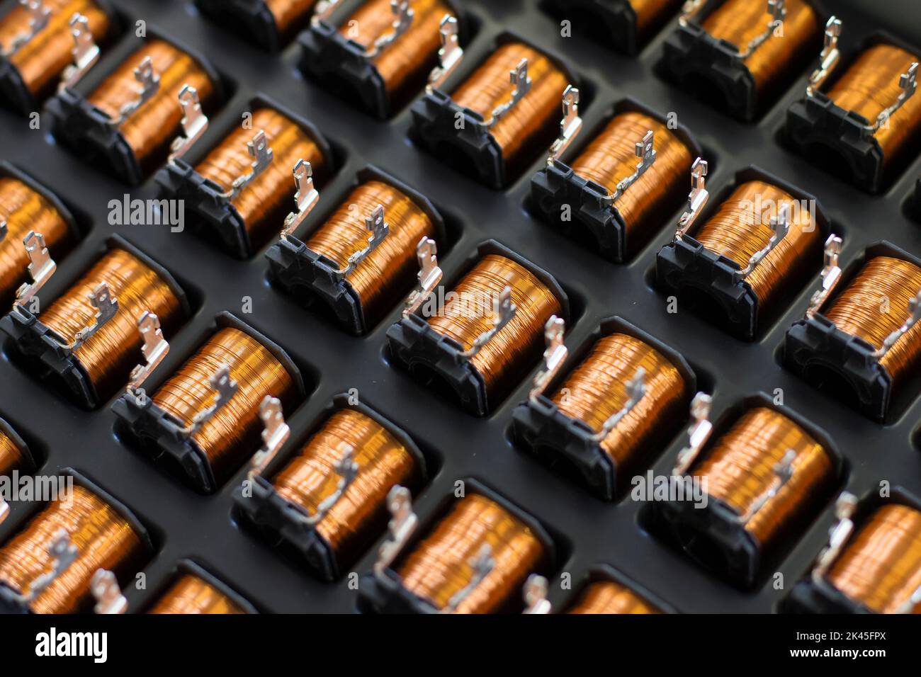 Close up on industrial coils made of copper Stock Photo - Alamy