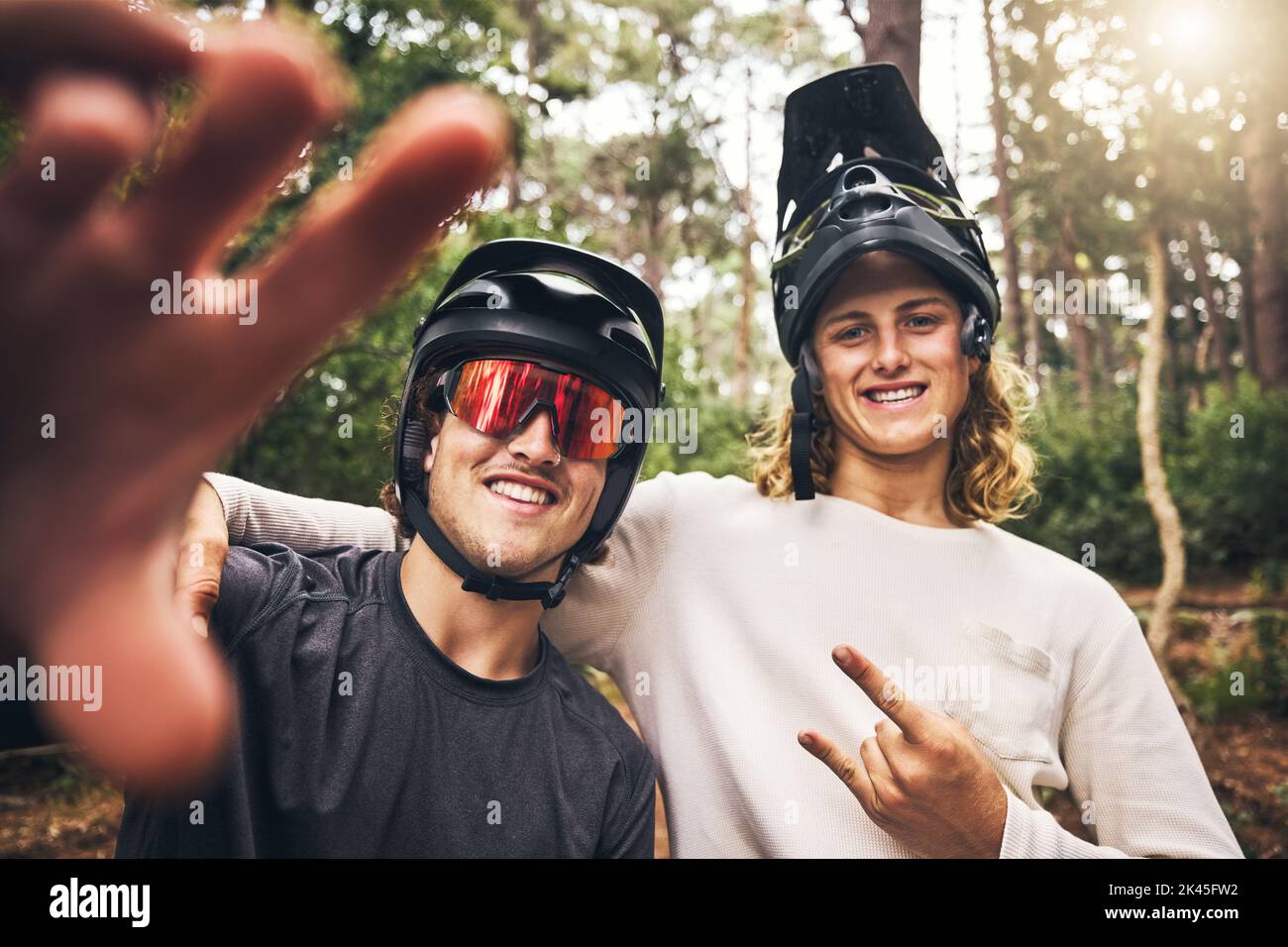 Forest, cycling and friends take a selfie in nature on an outdoor ...