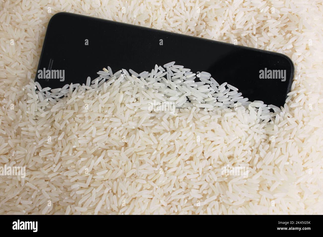 Smartphone in Bowl of White Rice to Remove Water and Mositure From ...