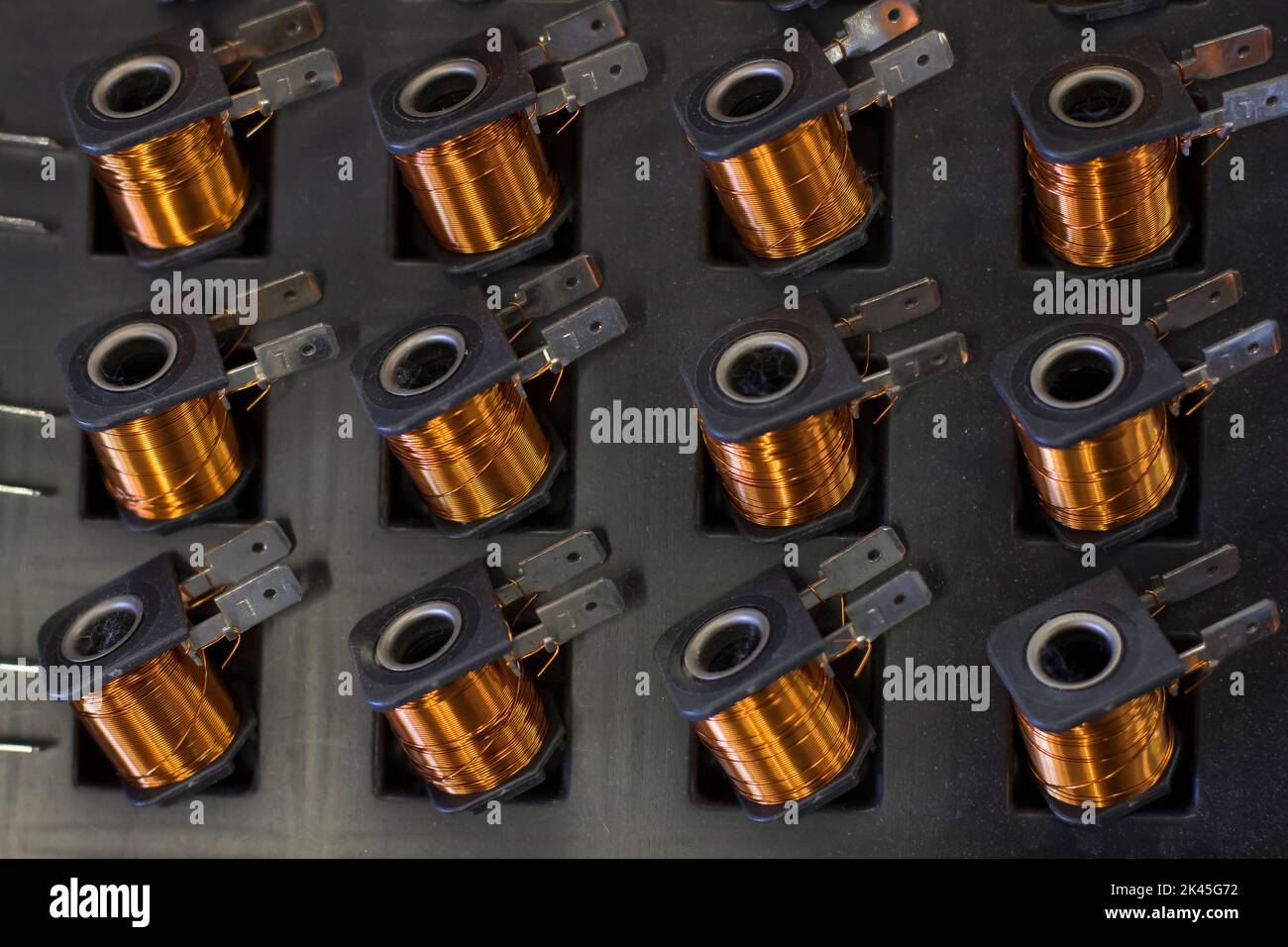Close up on industrial coils made of copper Stock Photo - Alamy