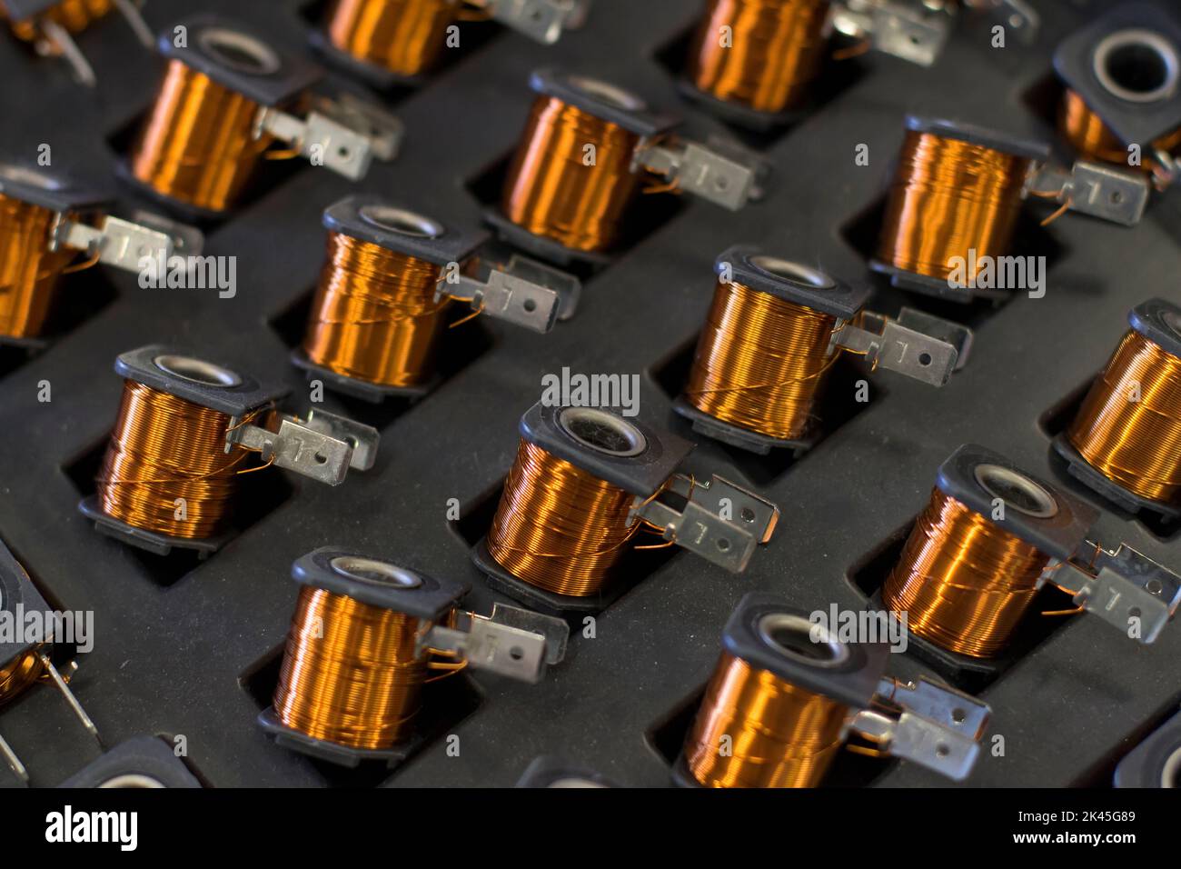 Close up on industrial coils made of copper Stock Photo - Alamy