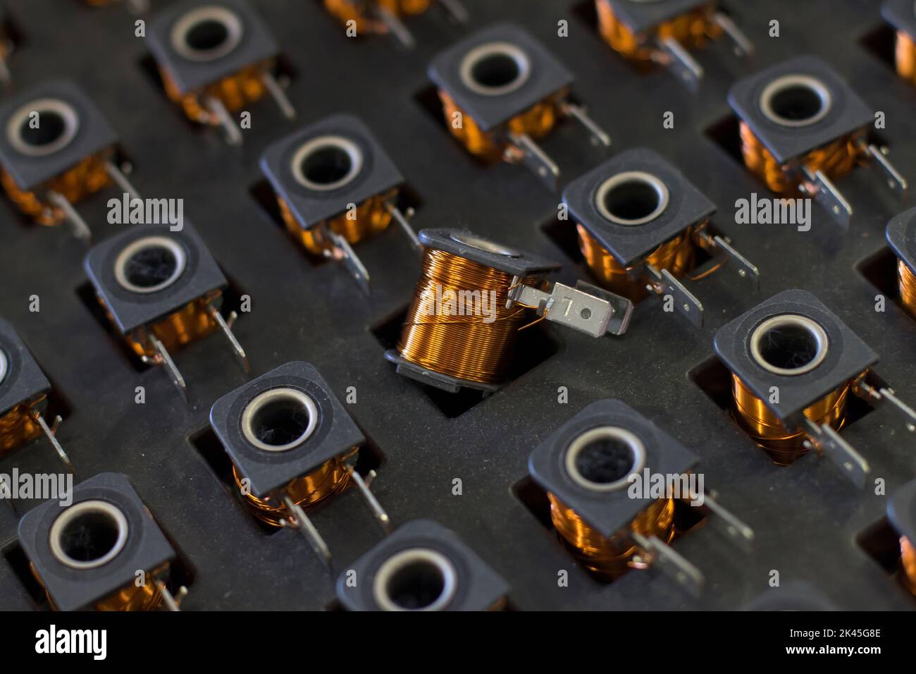 Close up on industrial coils made of copper Stock Photo - Alamy