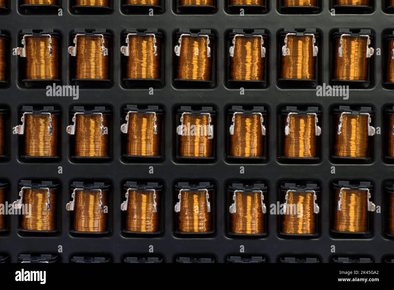 Close up on industrial coils made of copper Stock Photo - Alamy