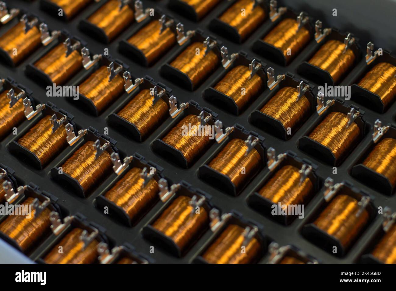 Close up on industrial coils made of copper Stock Photo - Alamy