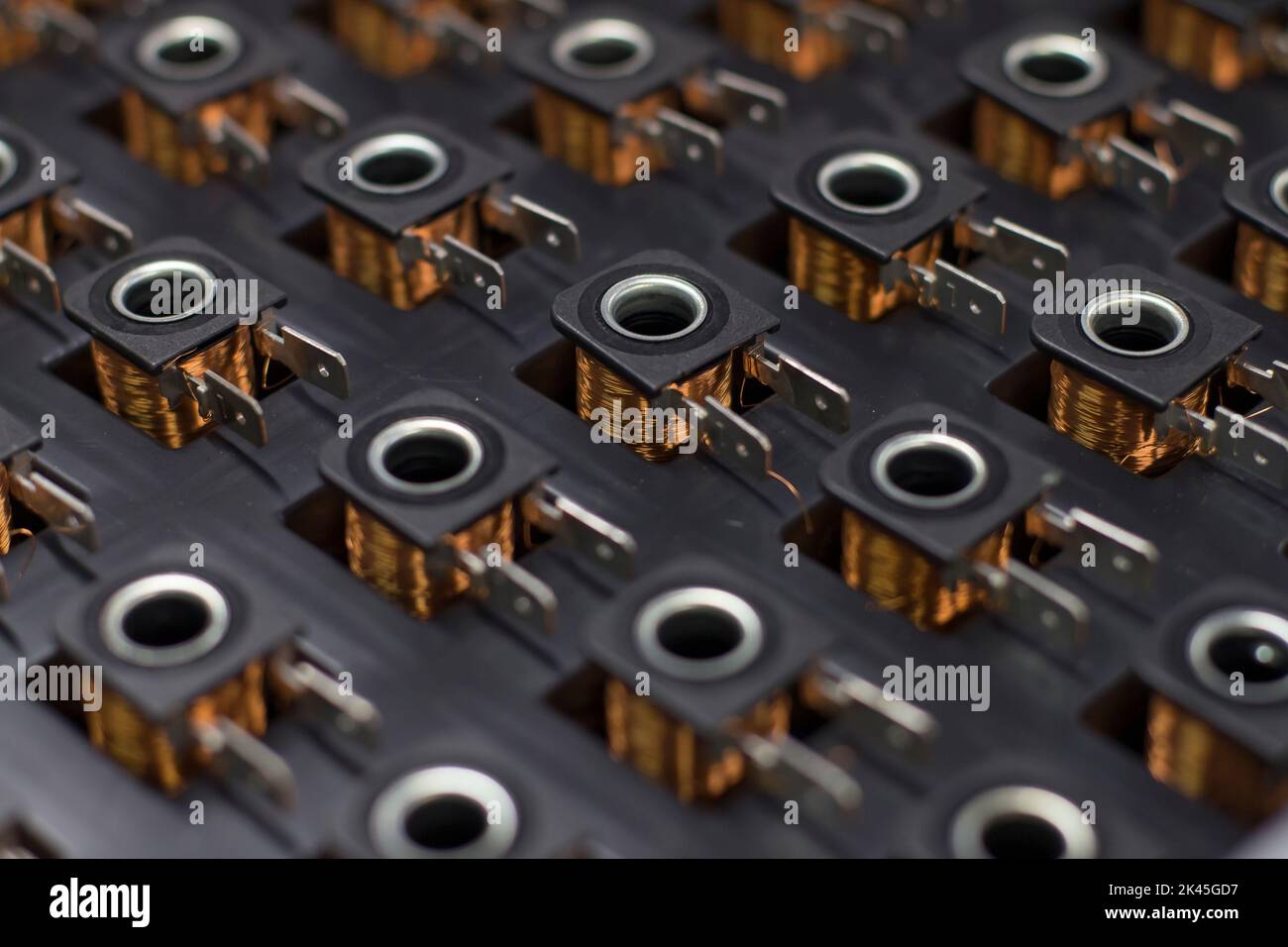 Close up on industrial coils made of copper Stock Photo - Alamy