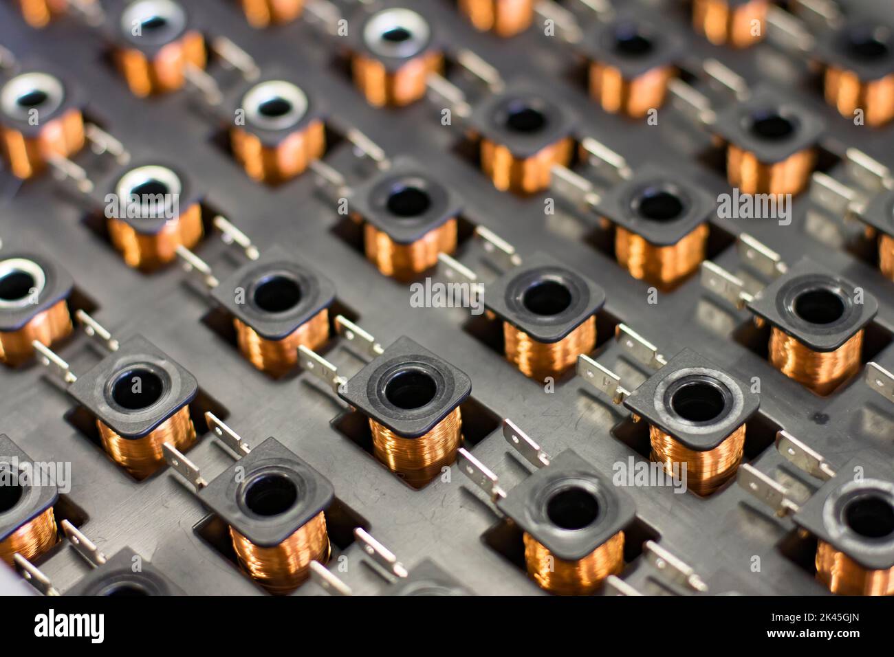 Close up on industrial coils made of copper Stock Photo - Alamy
