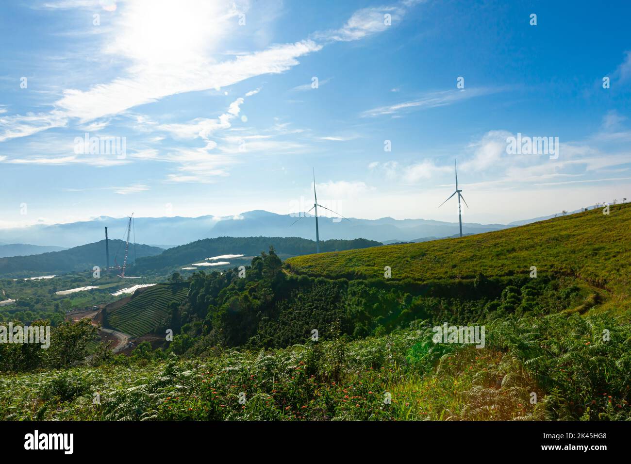 Renewable energy wind turbines windmill isolated on the beautiful blue ...