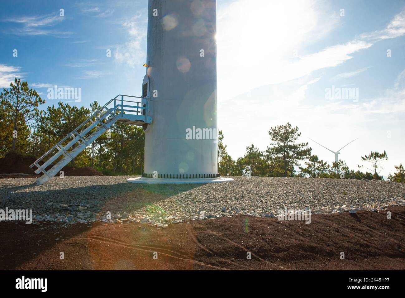 the stairs at the foot of the energy wind turbines on the beautiful ...