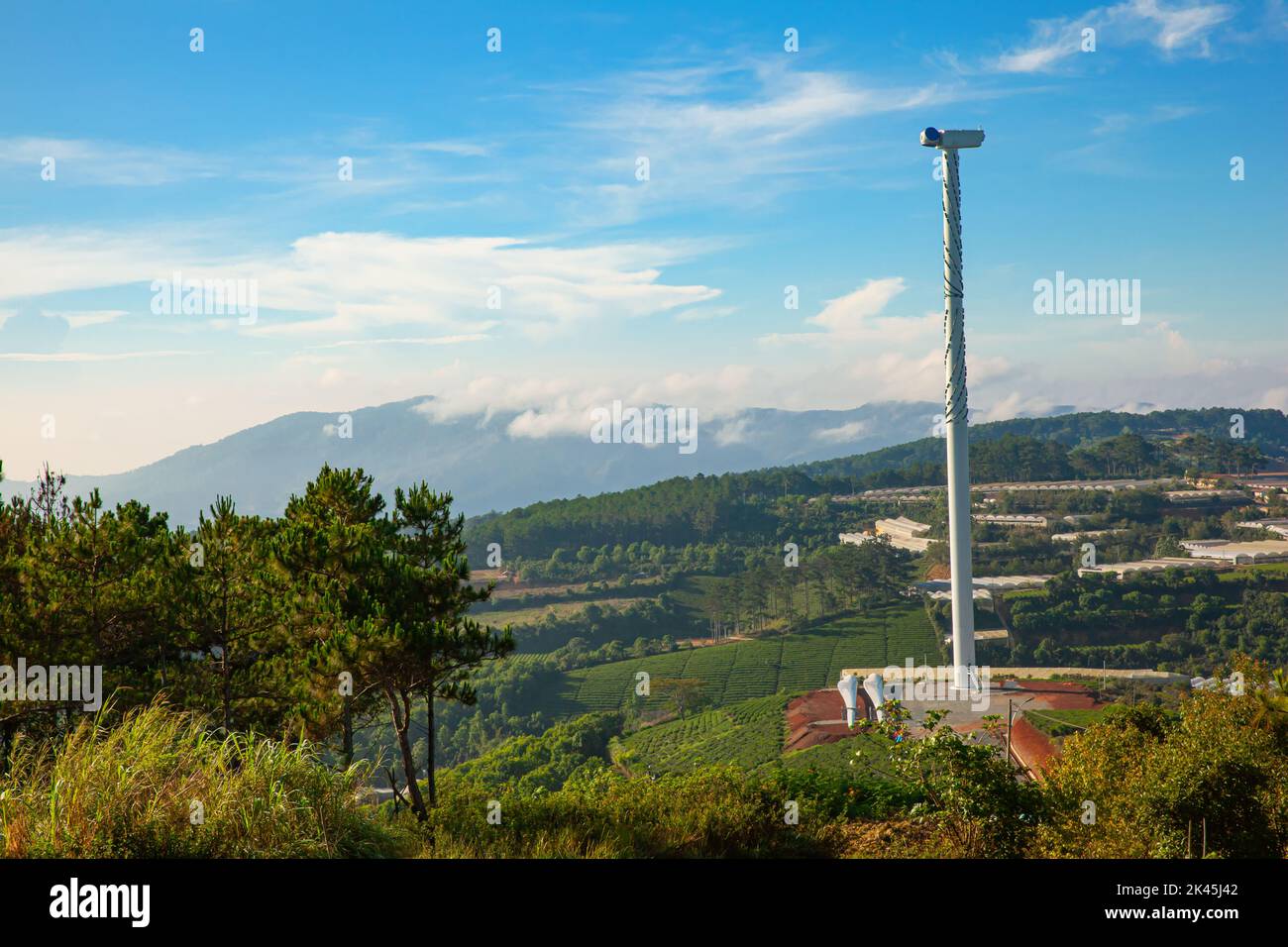 Renewable energy wind turbines windmill isolated on the beautiful blue ...