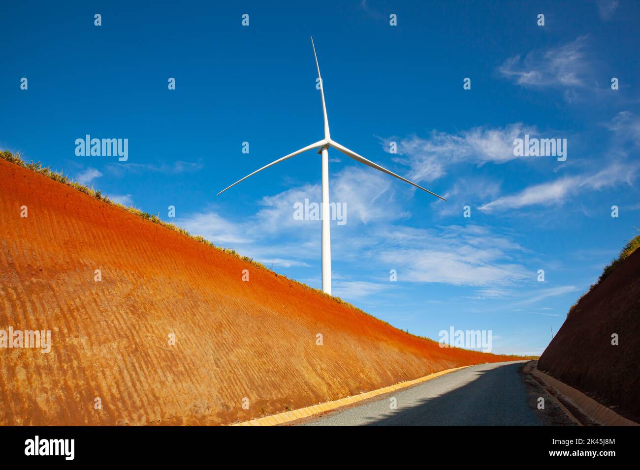 Renewable energy wind turbines windmill isolated on the beautiful blue ...