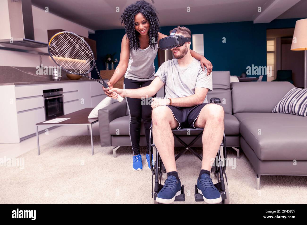 young girl helps a disabled who plays tennis with augmented reality ...