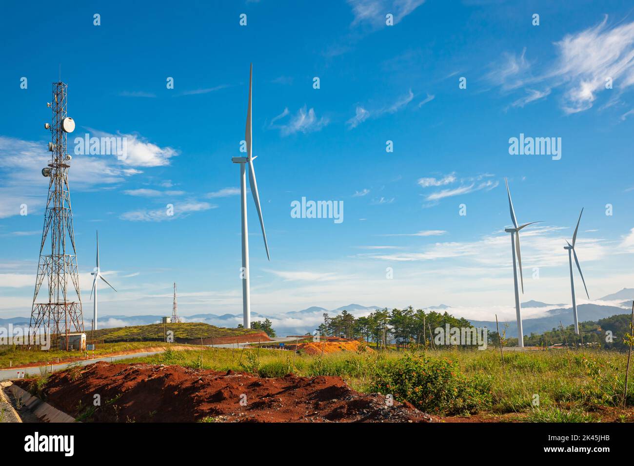 Renewable energy wind turbines windmill isolated on the beautiful blue ...