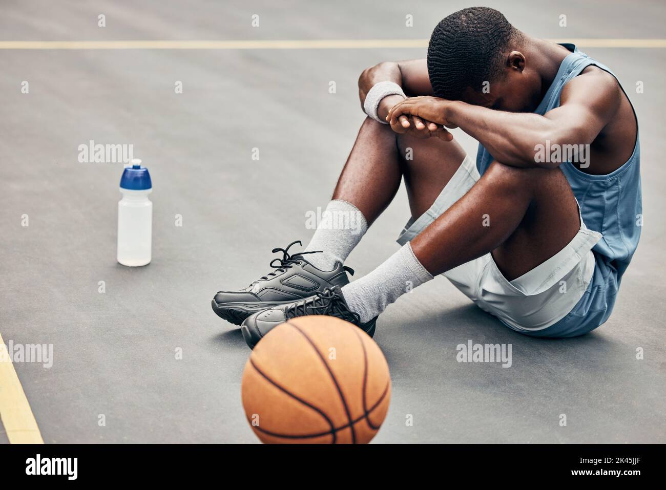 Tired, depression or sad basketball player with training gear after ...