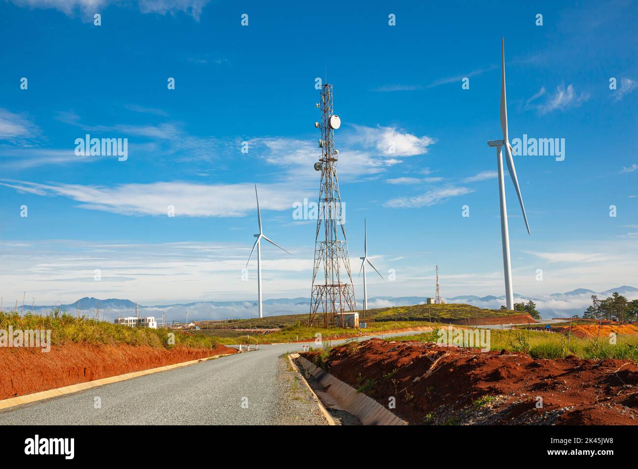 Renewable energy wind turbines windmill isolated on the beautiful blue ...