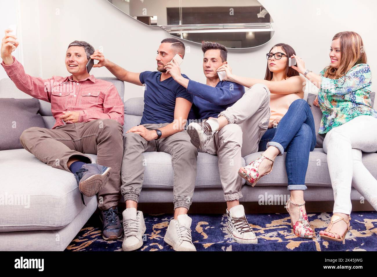 group of friends on couch takes a selfie in a funny way Stock Photo - Alamy