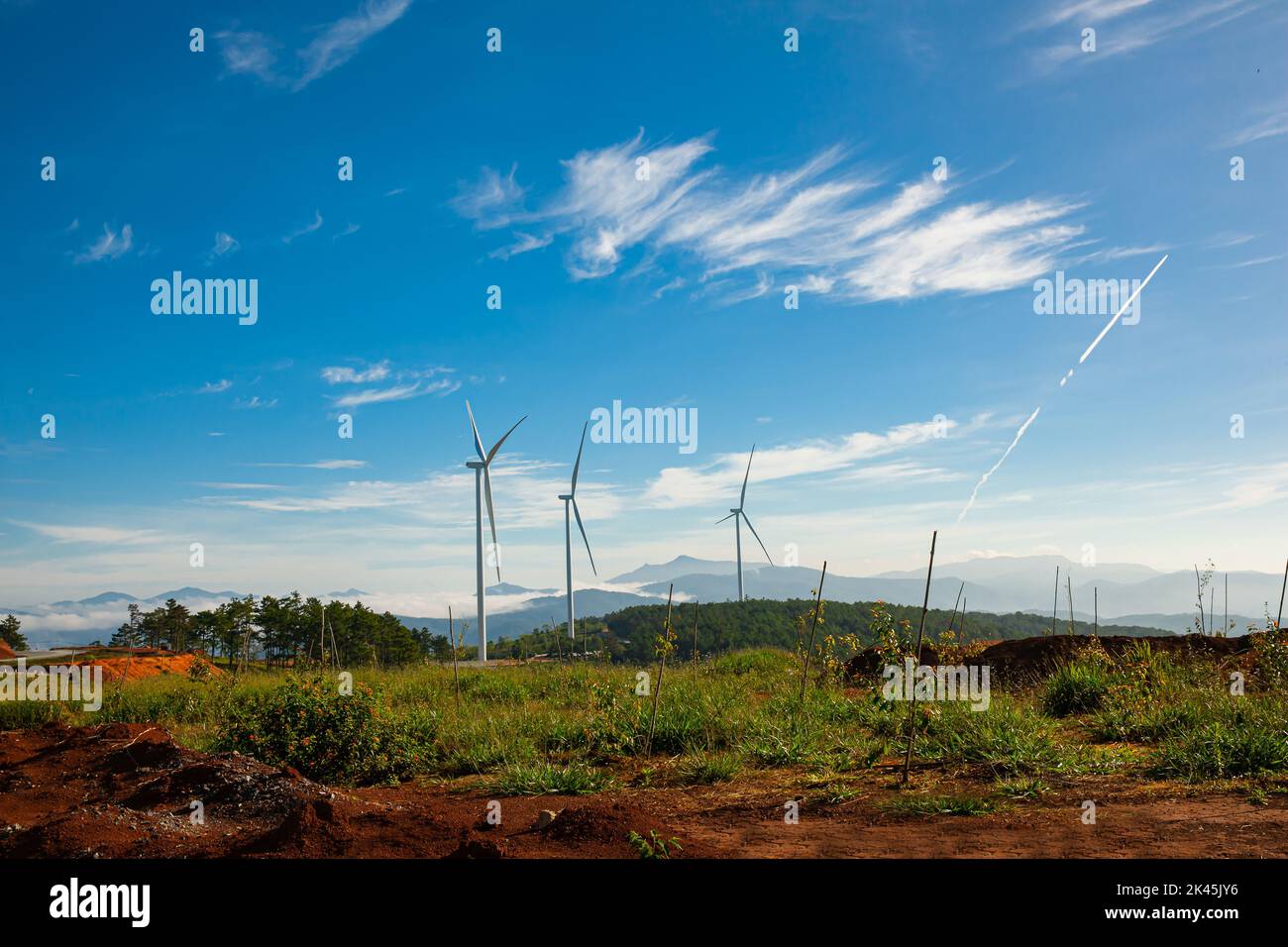 Renewable energy wind turbines windmill isolated on the beautiful blue ...