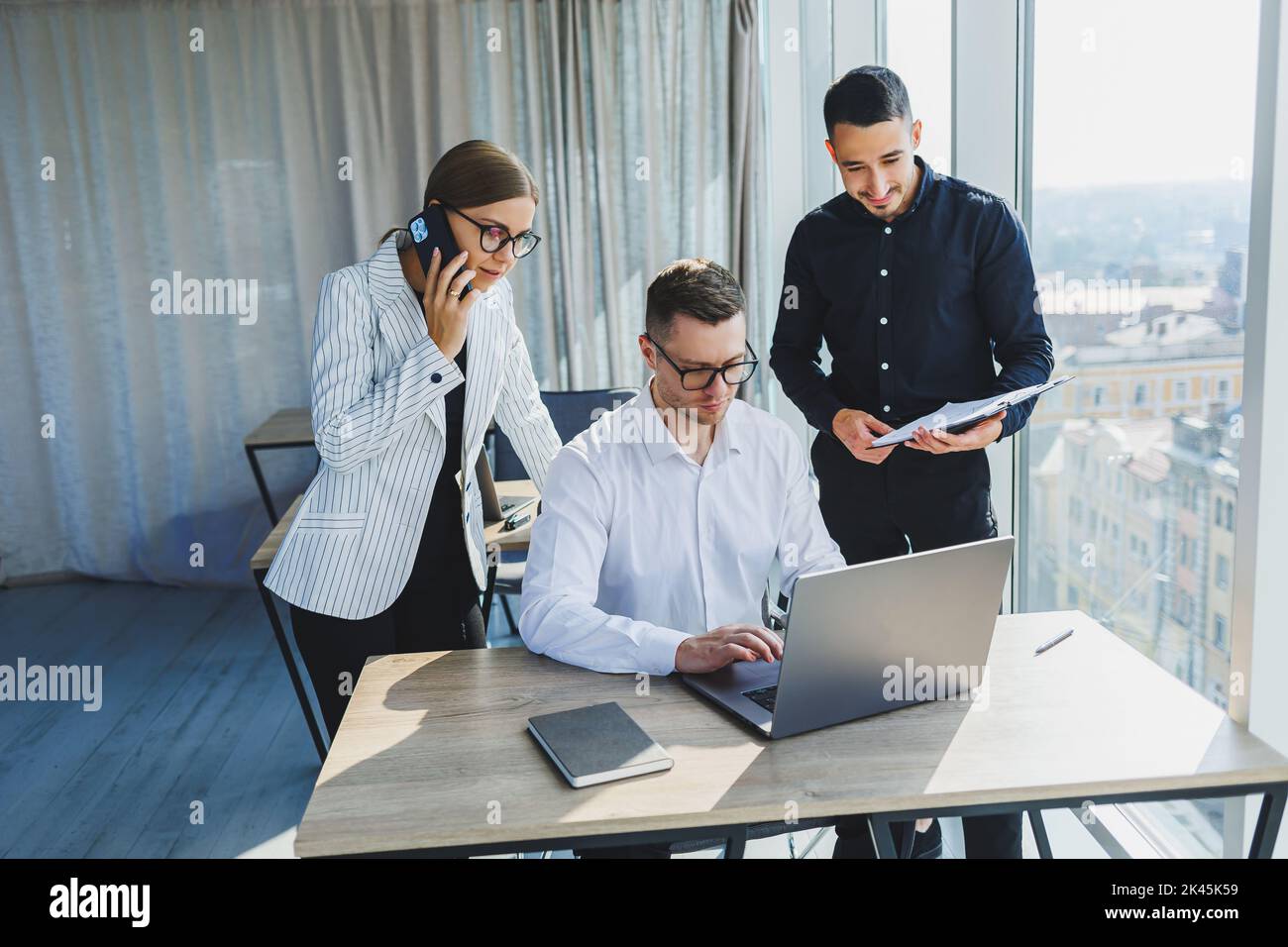 Group of business people in casual clothes talking to each other in ...