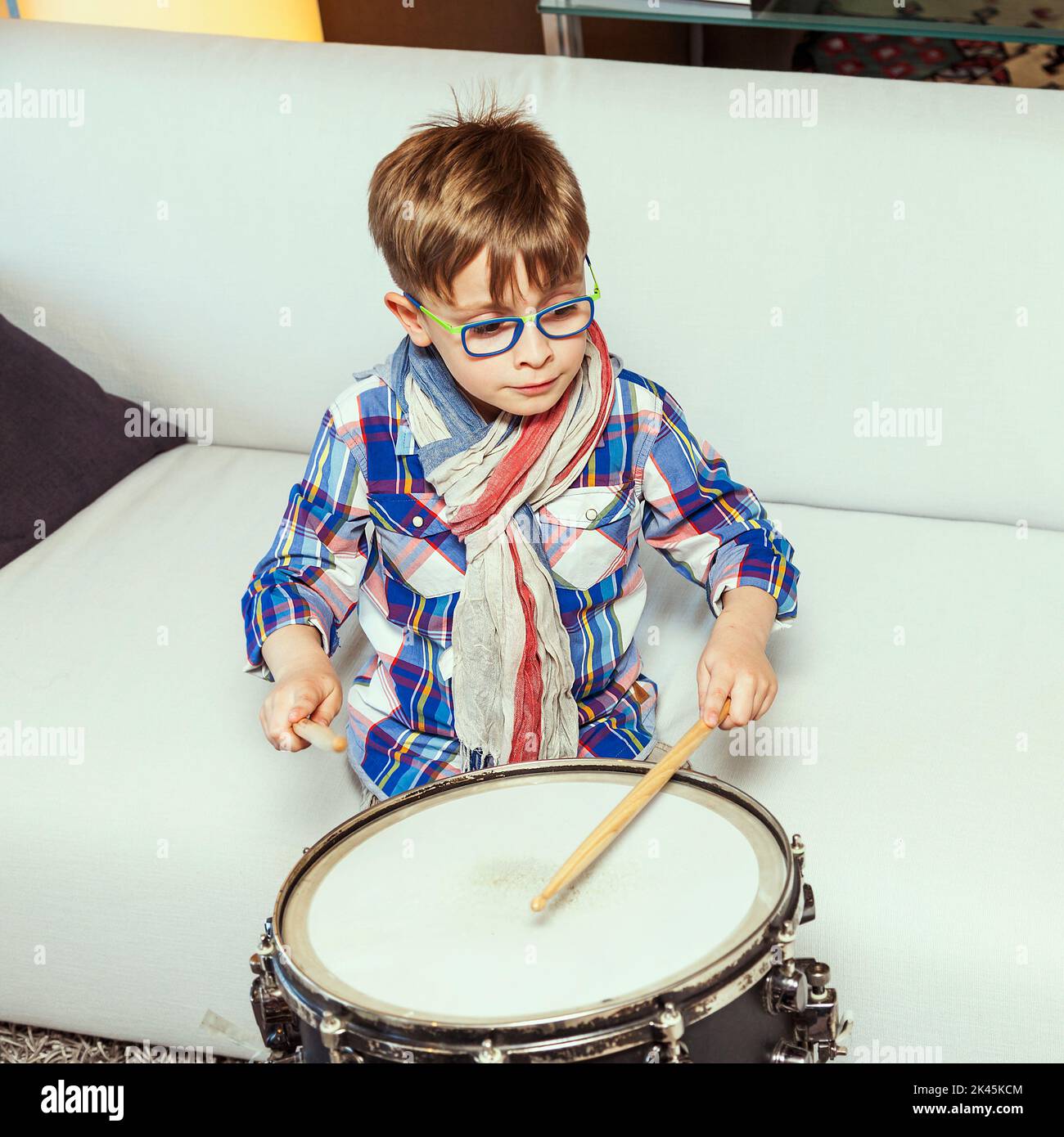 prodigy child plays the drums at home in his modern apartment Stock ...