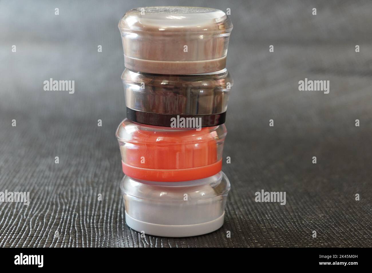 glass Bottle with multi colored plastic caps on black background Stock ...