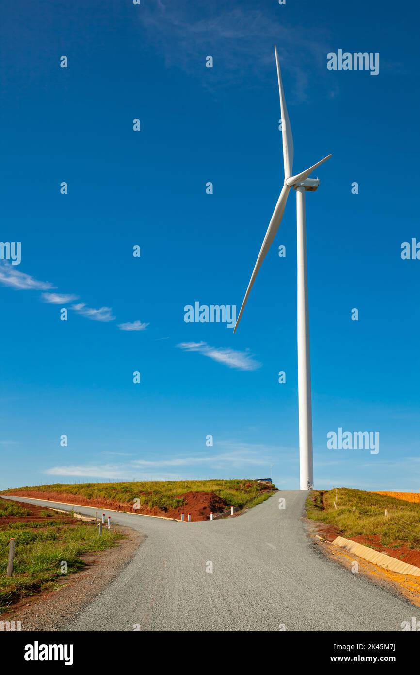 Renewable energy wind turbines windmill isolated on the beautiful blue ...
