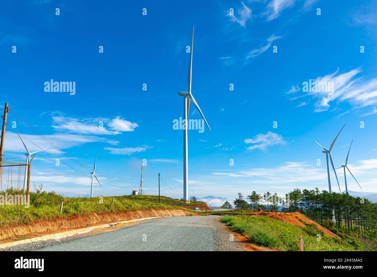 Renewable energy wind turbines windmill isolated on the beautiful blue ...