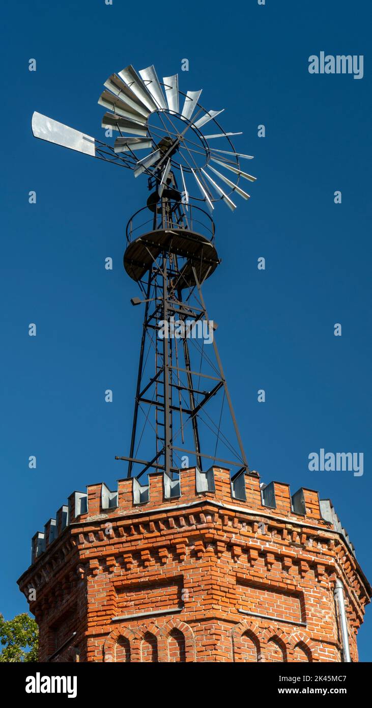 Old Red Brick Water Tower Windmill Weather Vane. View at Dawn of an Old ...