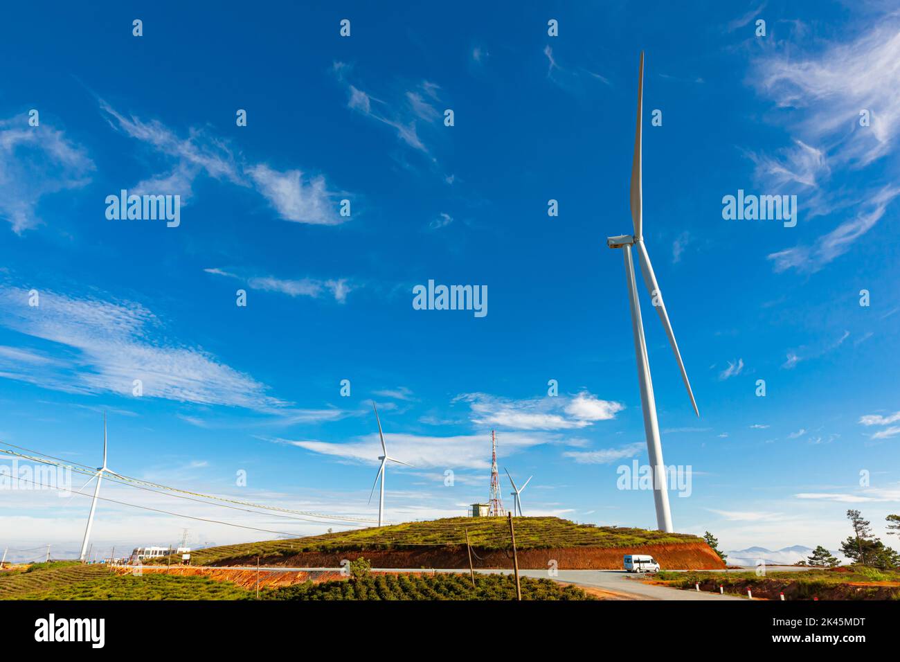 Renewable energy wind turbines windmill isolated on the beautiful blue ...