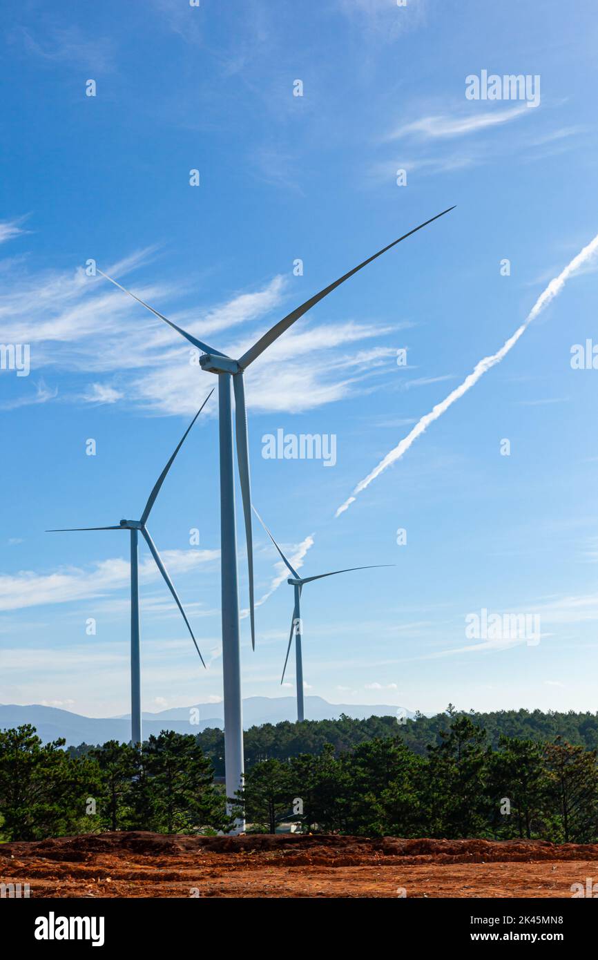 Renewable energy wind turbines windmill isolated on the beautiful blue ...