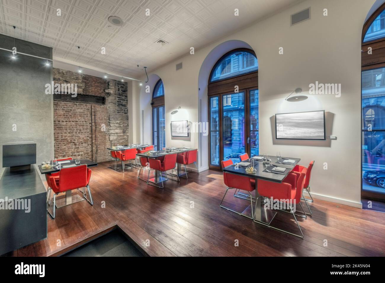 Modern restaurant interior with red chairs Stock Photo - Alamy