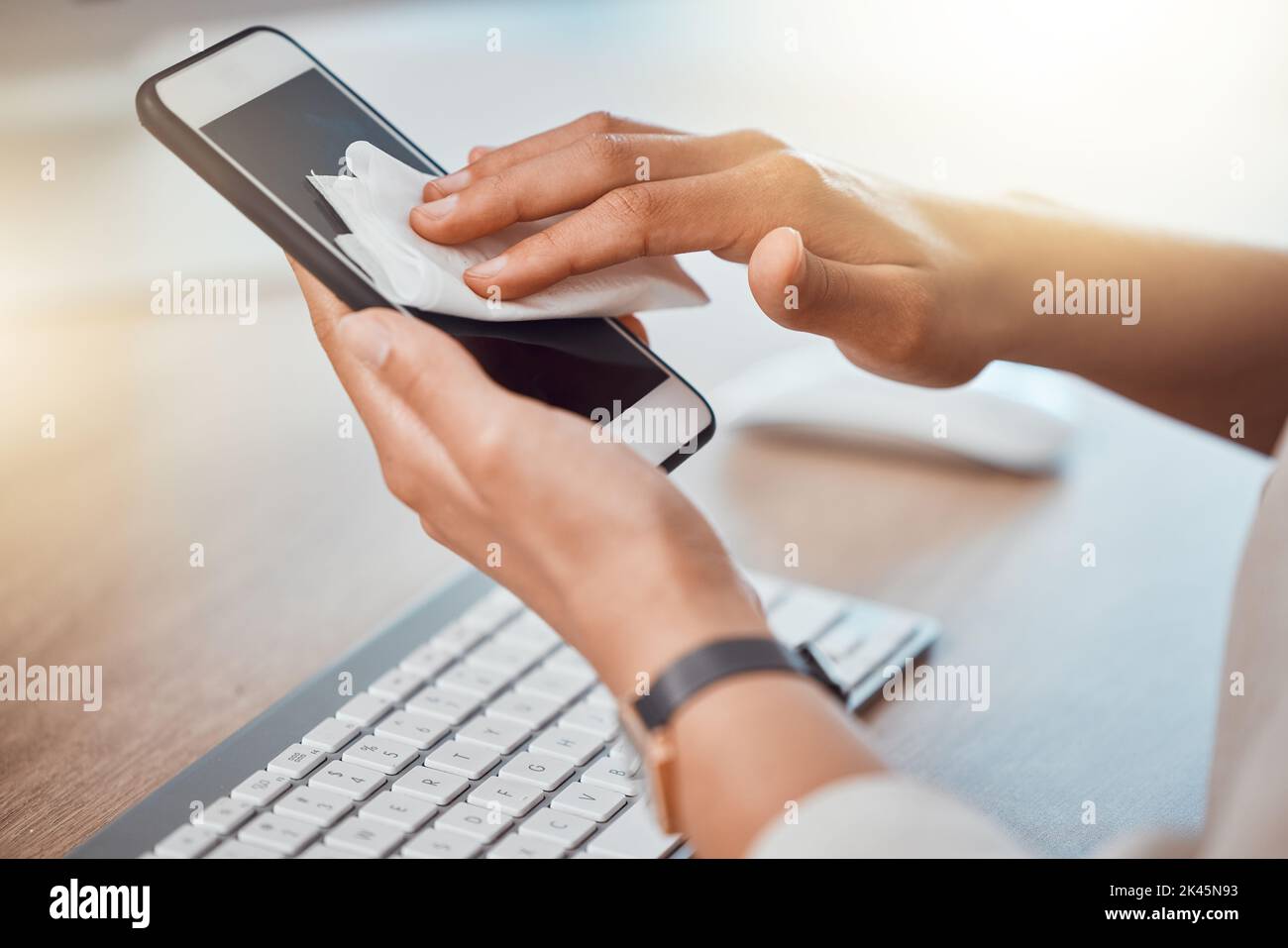 Female hand wipes smartphone hi-res stock photography and images - Alamy
