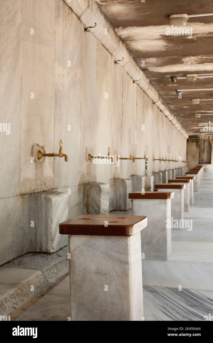 The Blue Mosque, Istanbul, a row of marble seats and taps for the ...
