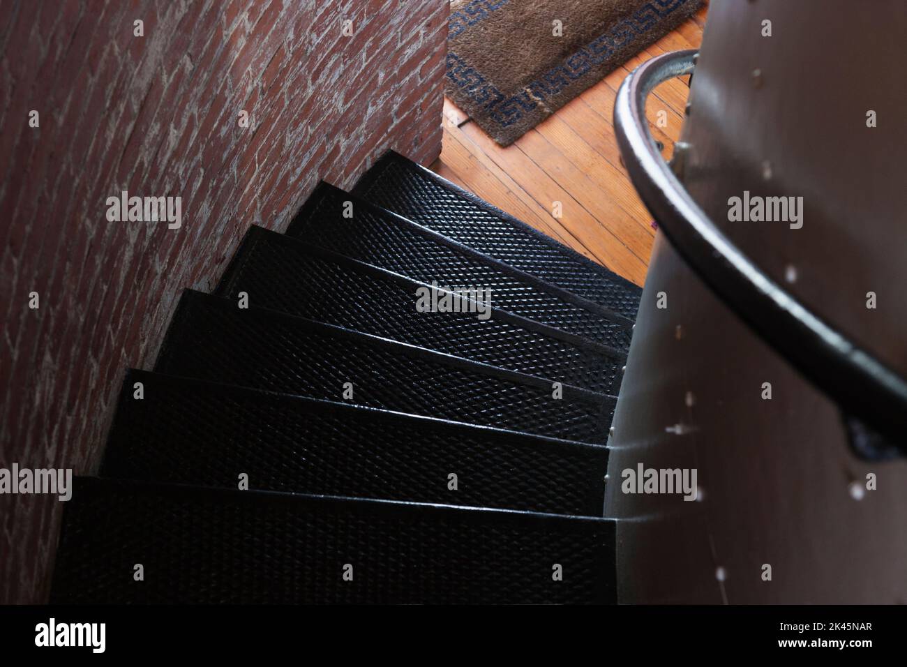 Spiral stairs, a staircase with a railing twisting and turning in a ...