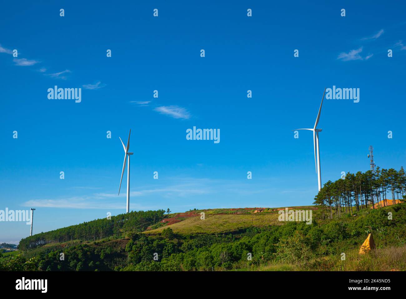 Renewable energy wind turbines windmill isolated on the beautiful blue ...
