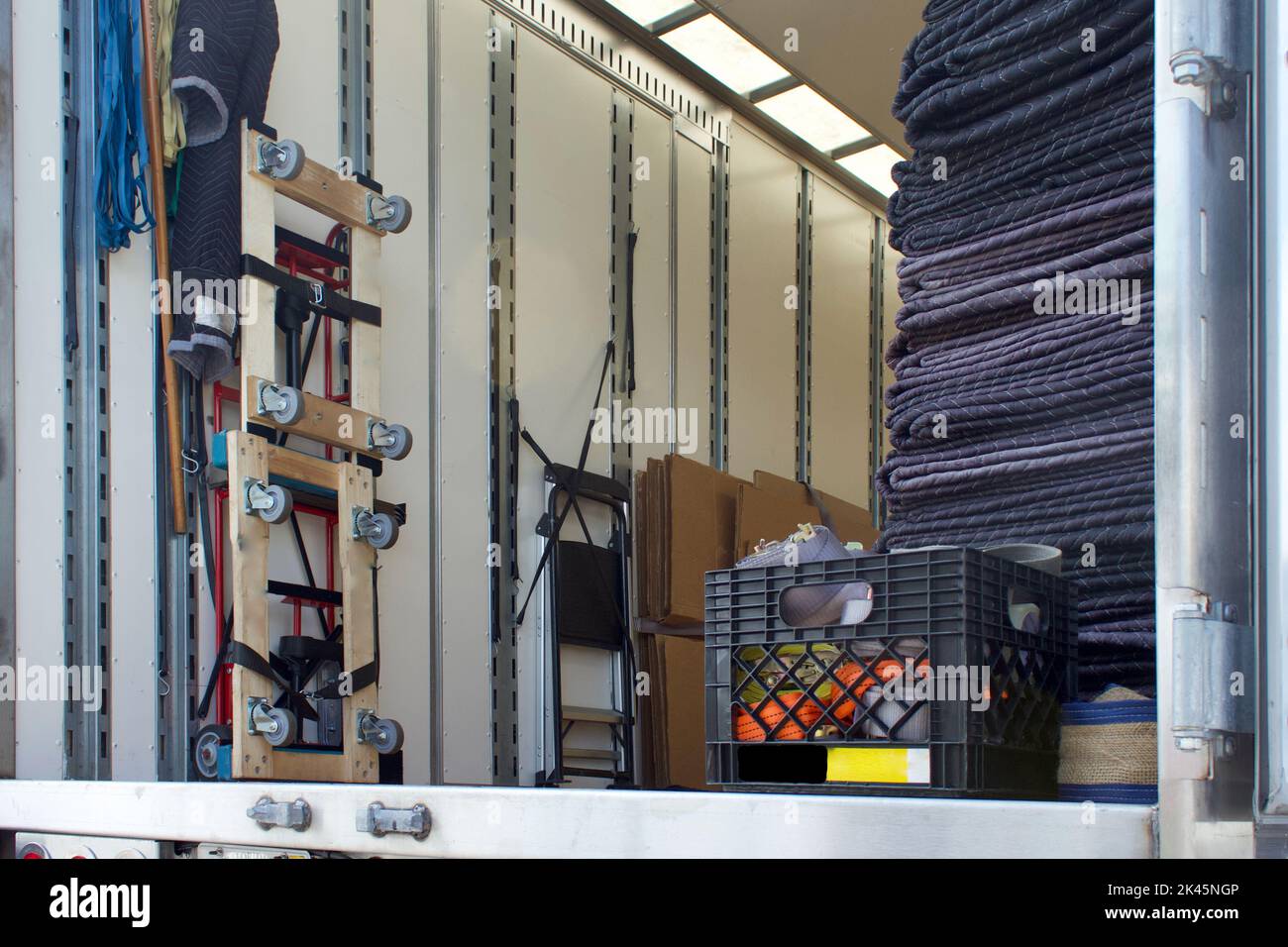 Empty moving and storage van with furniture dollies,moving blankets ...