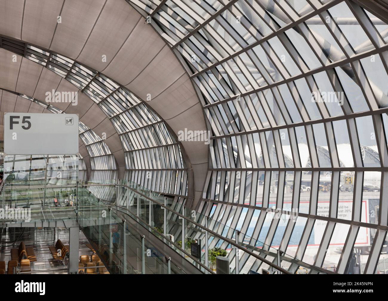 Departure gate at Bangkok Airport, an elevated view of a curved glass ...