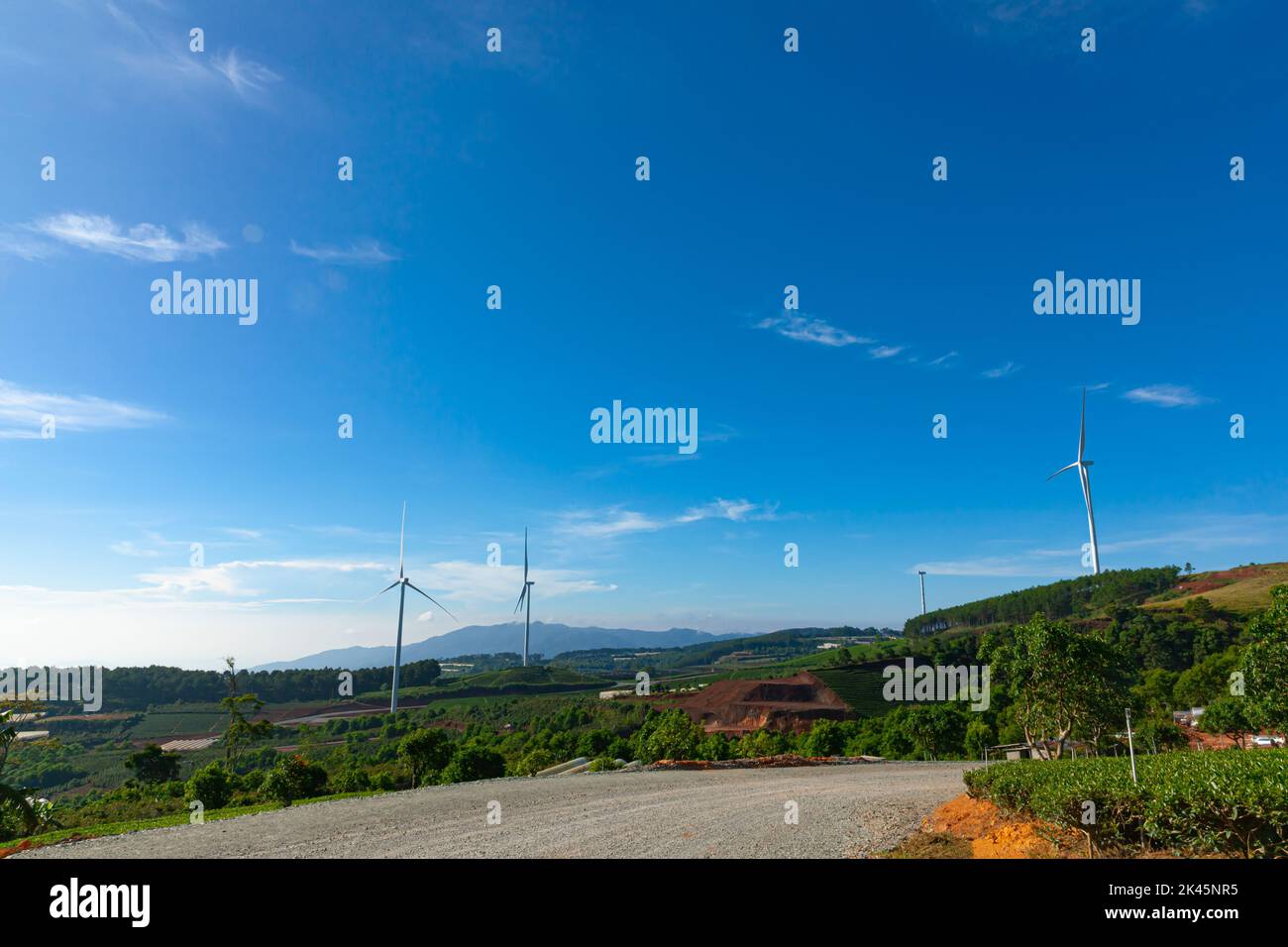 Renewable energy wind turbines windmill isolated on the beautiful blue ...