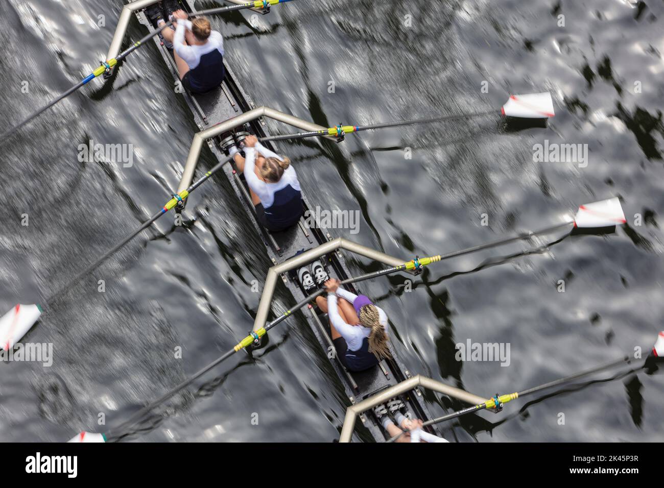 Overhead view of female crew racers rowing in an octuple racing shell ...
