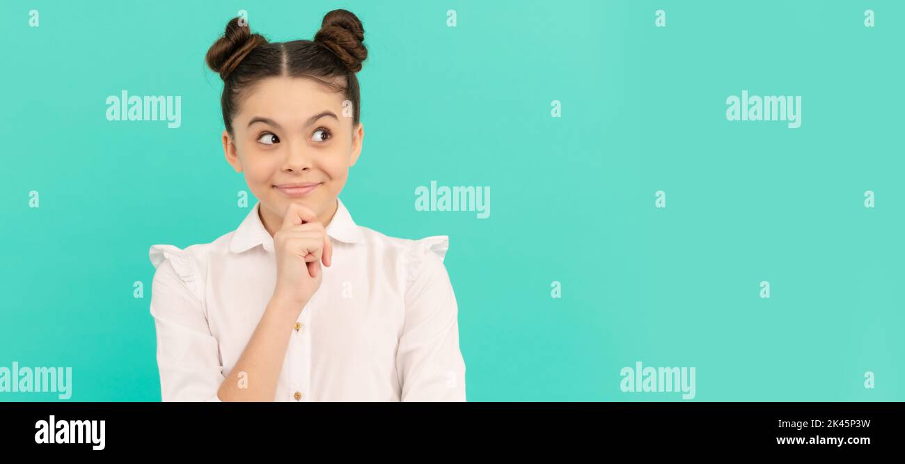 Happy primary school kid think looking away blue background, thinking ...