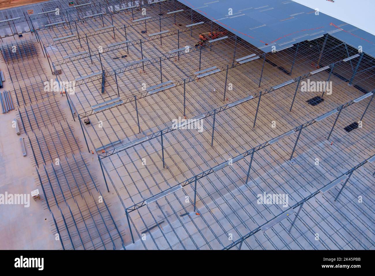 Construction of an industrial building roof truss frame has taken place ...