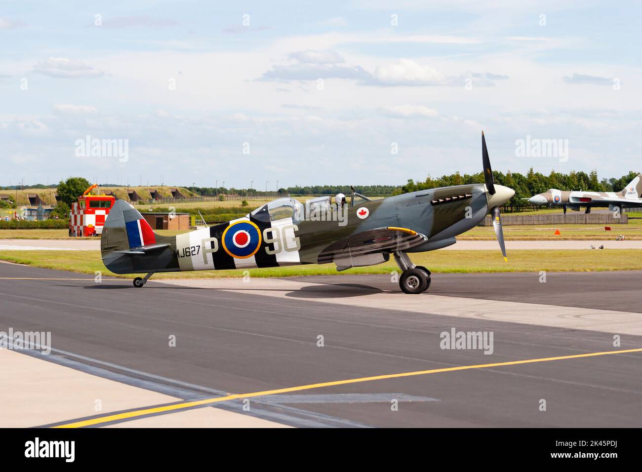 Private owned 2 seater trainer Spitfire MkIXT, MJ627 taxiing at RAF ...