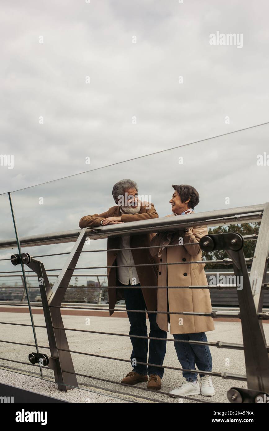 Man leaning on handrail hi-res stock photography and images - Alamy