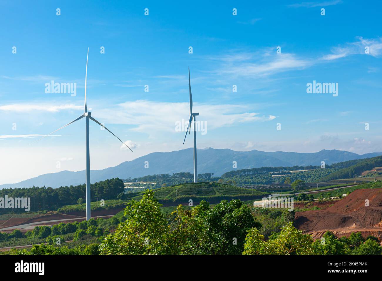Renewable energy wind turbines windmill isolated on the beautiful blue ...