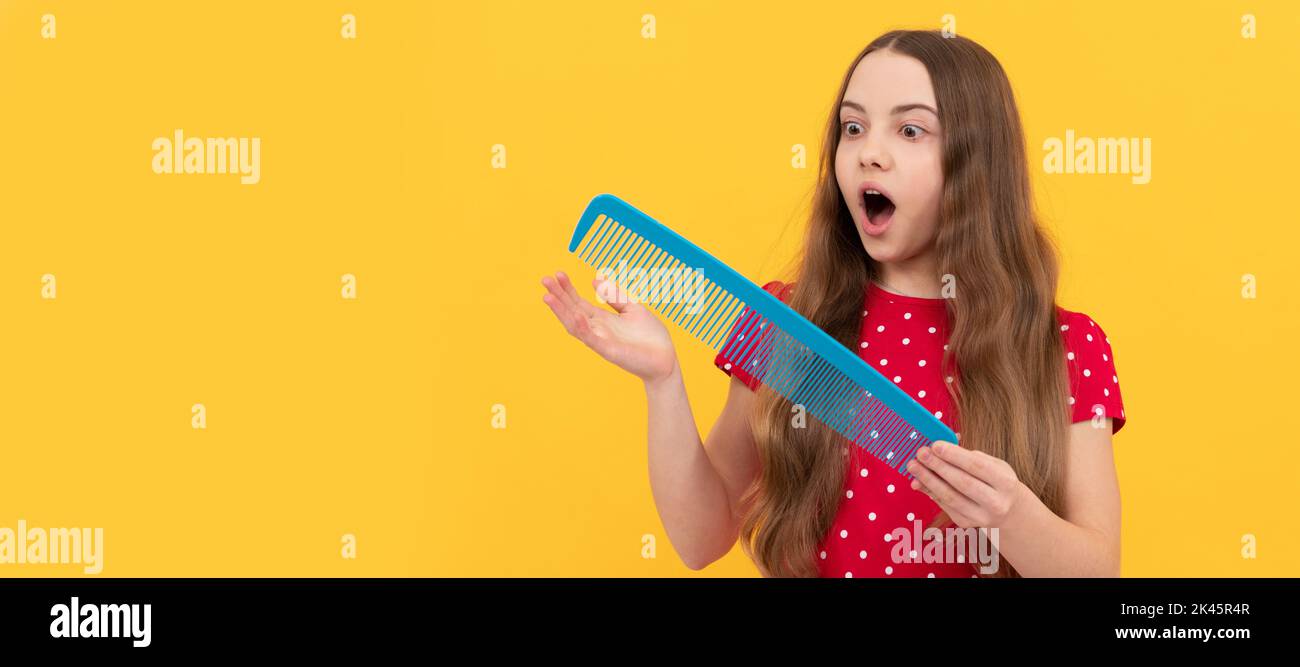 shocked girl has wavy hairdo hold hairbrush. teen beauty hairstyle ...