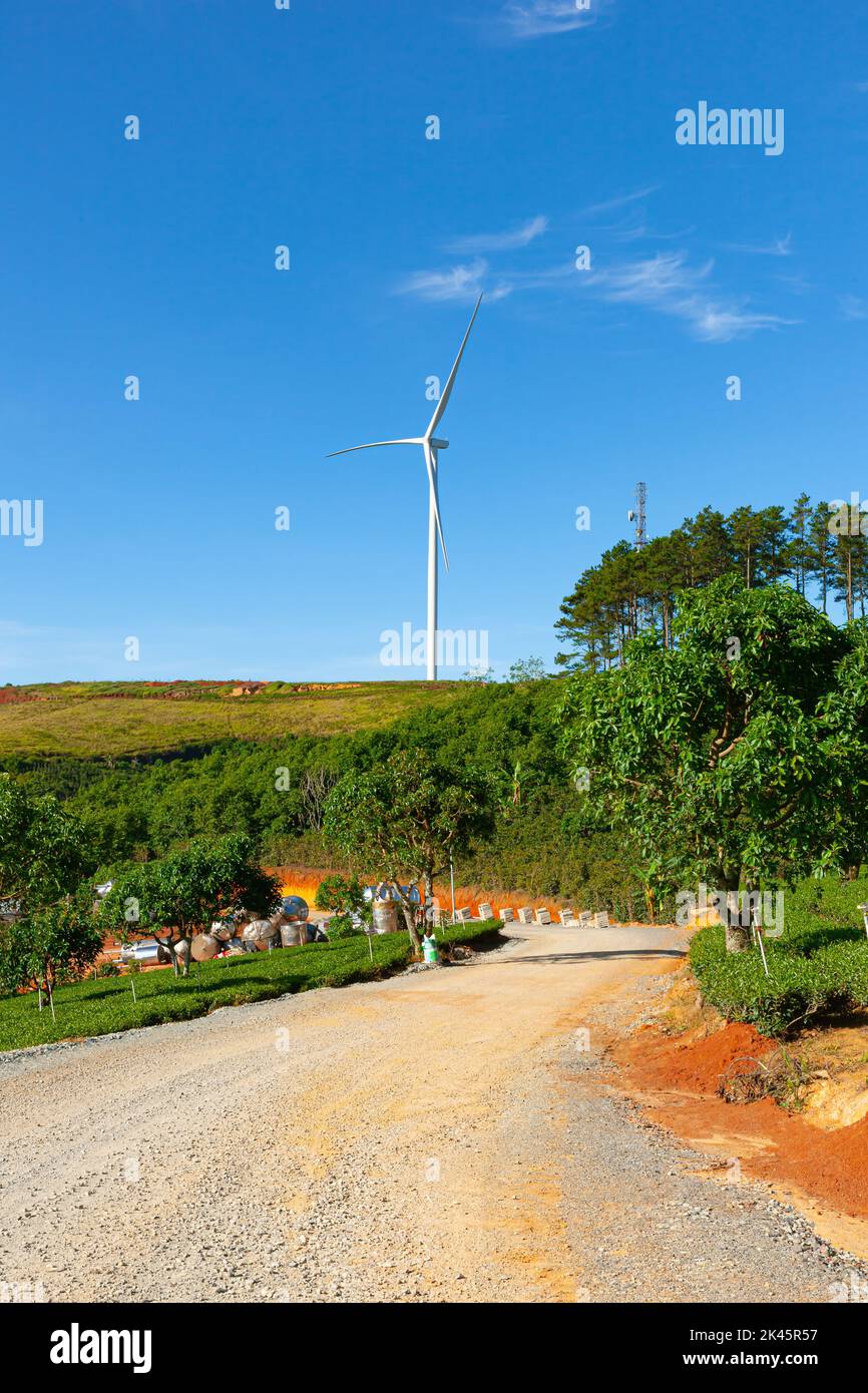 Renewable energy wind turbines windmill isolated on the beautiful blue ...