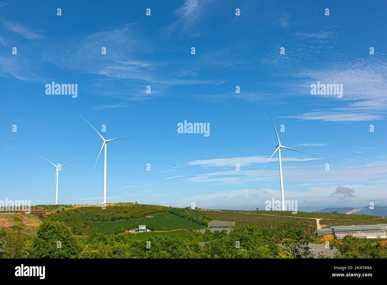 Renewable energy wind turbines windmill isolated on the beautiful blue ...