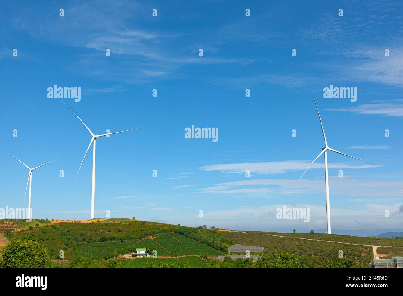 Renewable energy wind turbines windmill isolated on the beautiful blue ...