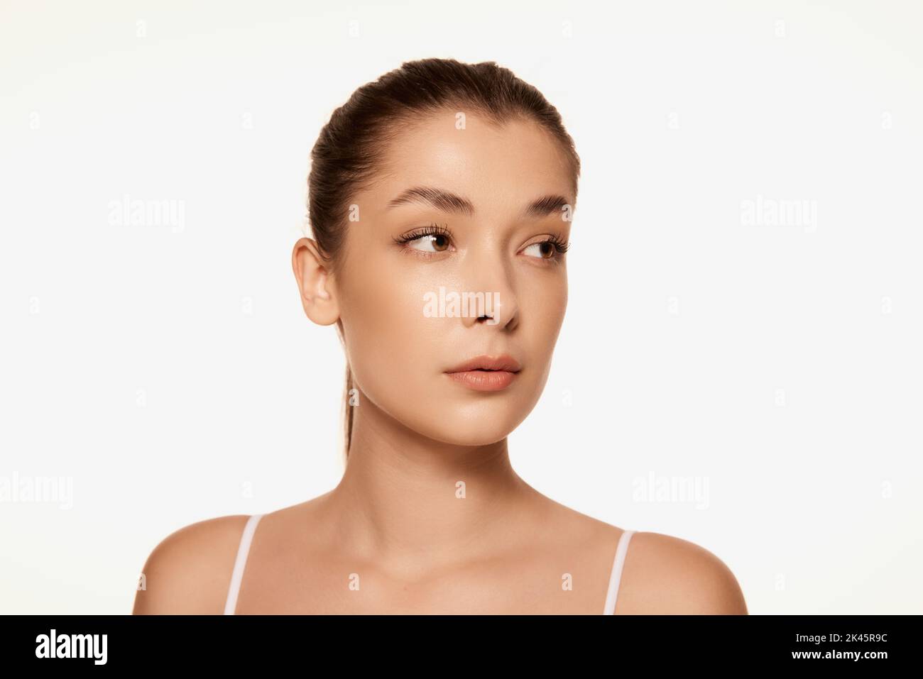 Portrait Of Young Beautiful Woman With Clear Spotless Skin Isolated