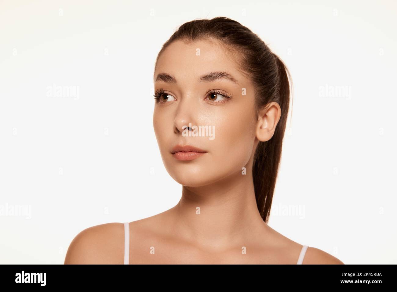 Portrait of young beautiful woman with clear spotless skin isolated ...